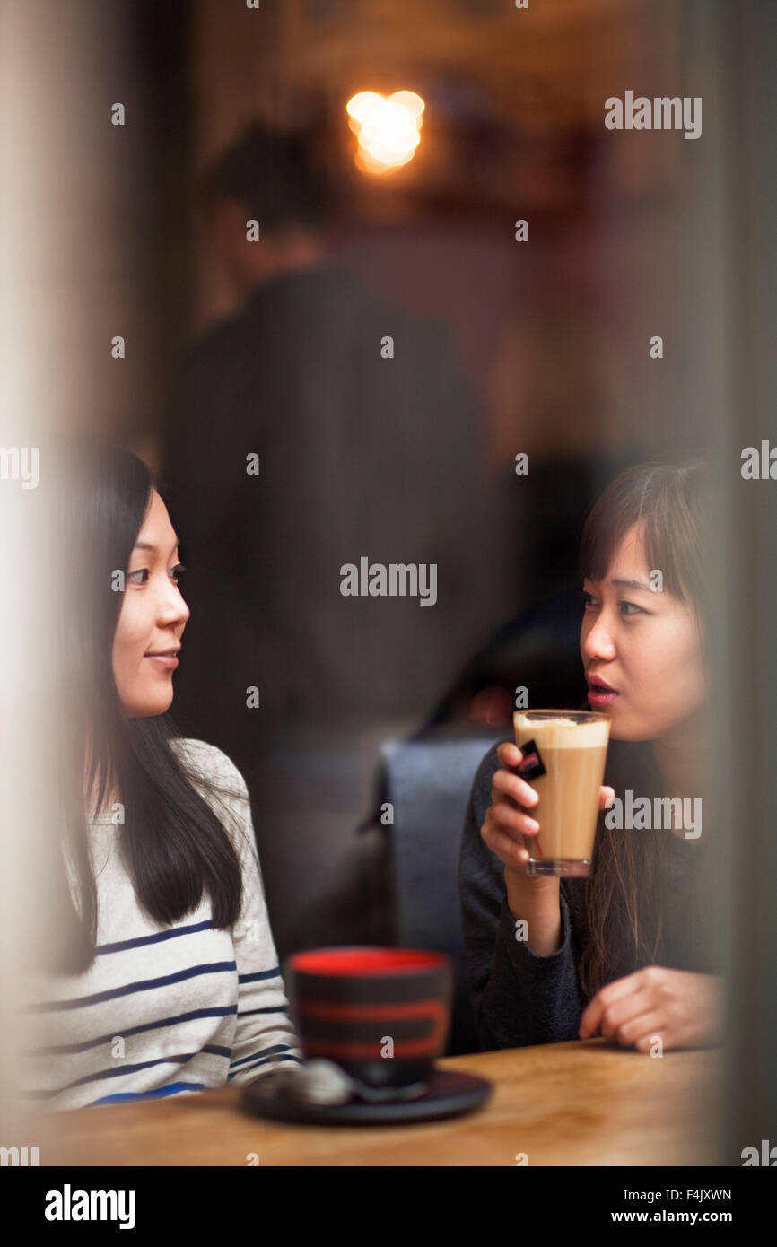 Two young friends in cafe bar Stock Photo - Alamy
