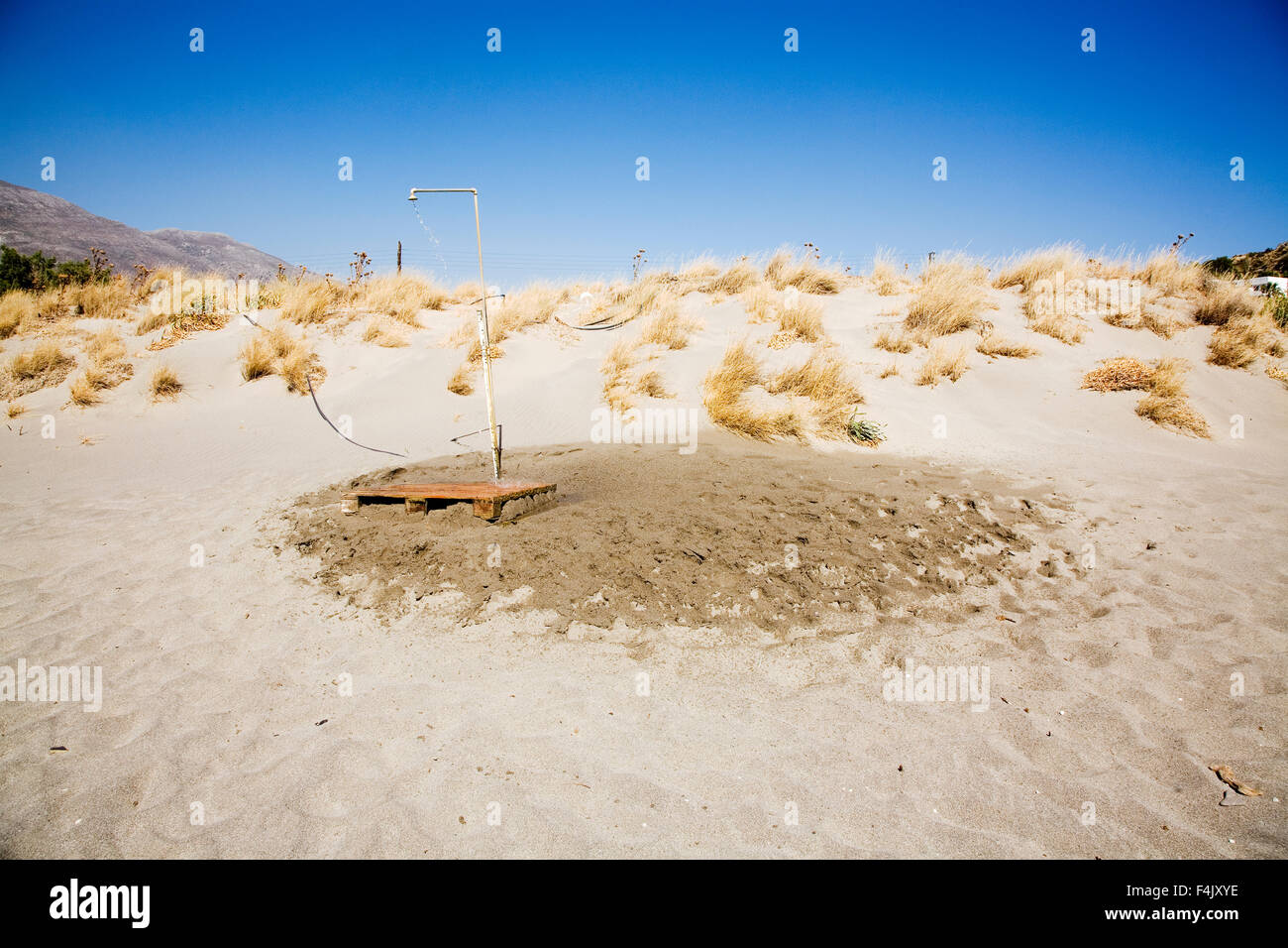 Shower on empty sandy beach Stock Photo - Alamy