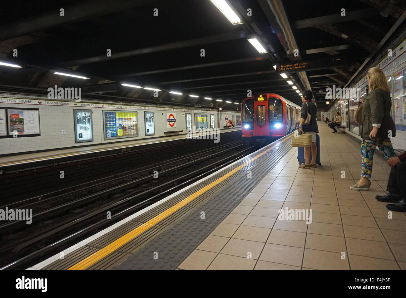 A Metropolitan Line train arriving at a platform at Euston Square ...