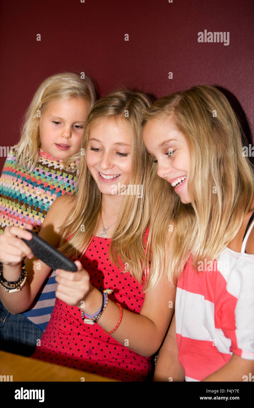 Three sisters playing video games Stock Photo - Alamy