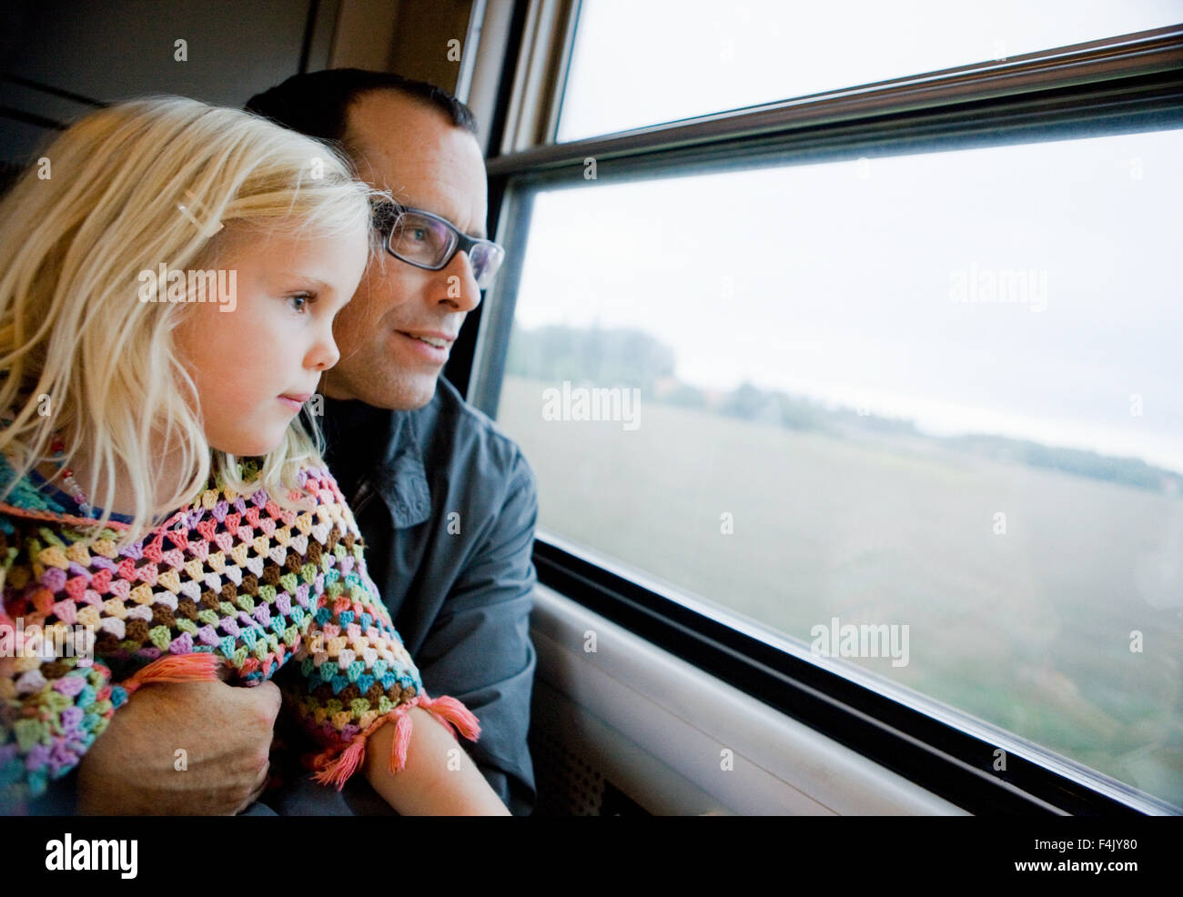 father with daughter traveling on high speed train Stock Photo - Alamy