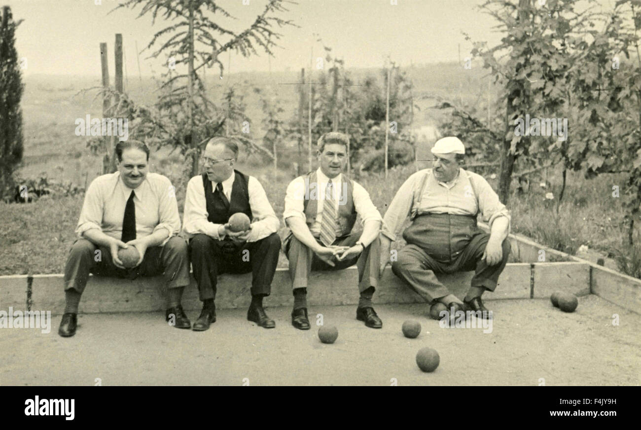 Four men playing boules, Italy Stock Photo - Alamy
