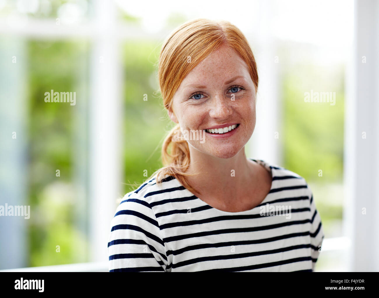 Redhead smiling woman, portrait Stock Photo - Alamy