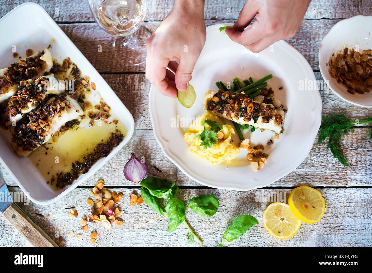 Man serving fish Stock Photo - Alamy