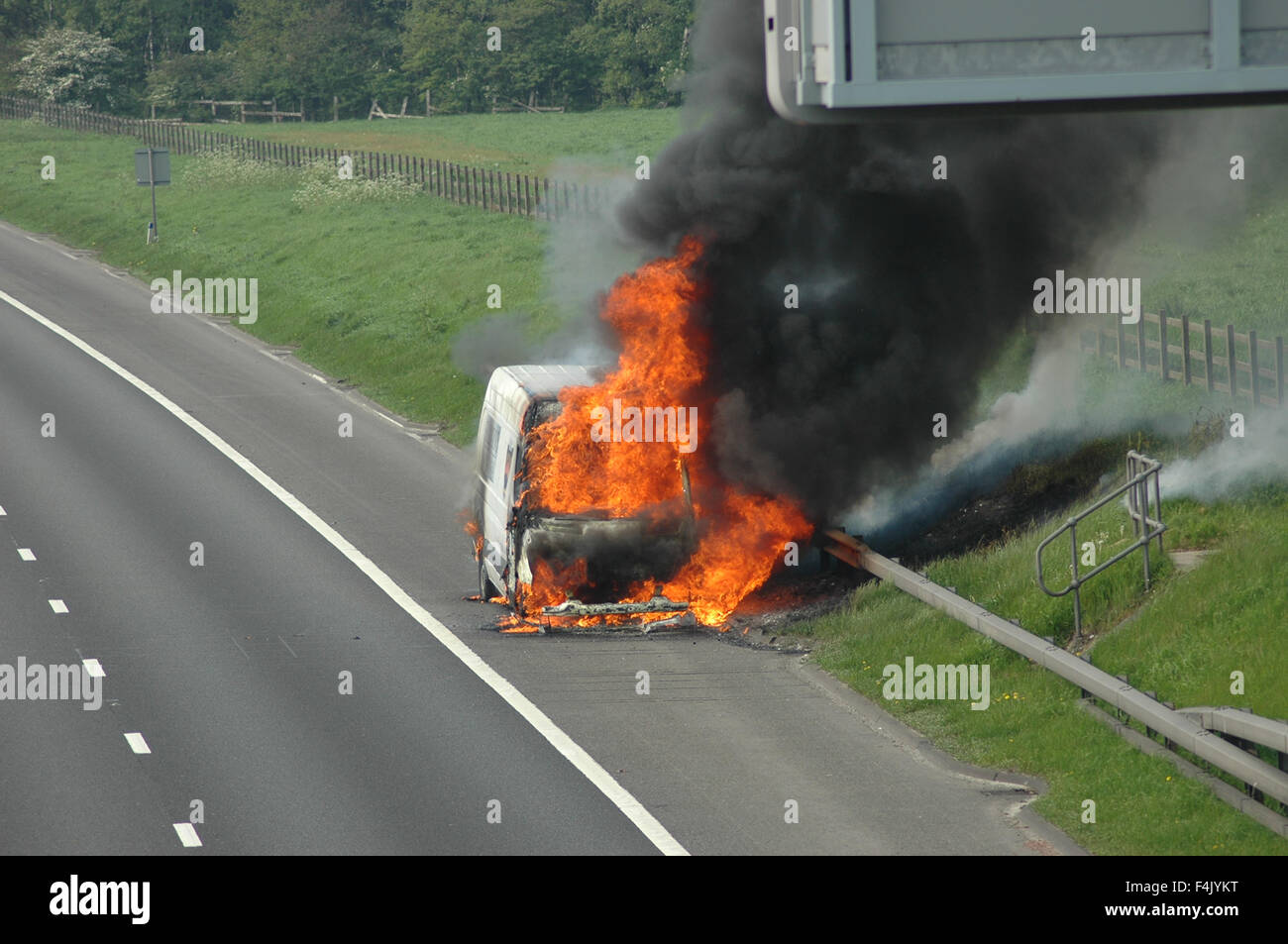 Firemen putting out a van fire on Motorway Stock Photo - Alamy