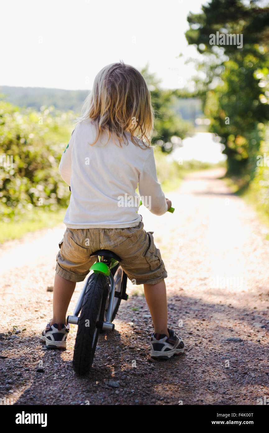Back view of girl on bike hi-res stock photography and images - Alamy