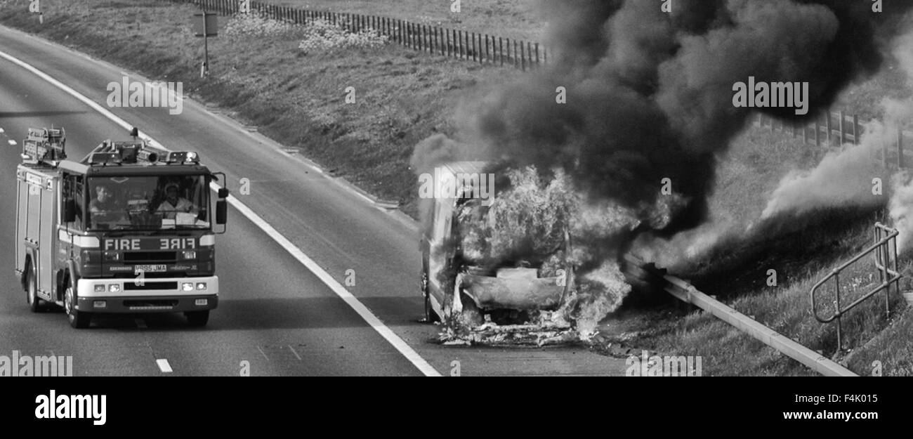 Firemen putting out a van fire on Motorway Stock Photo - Alamy