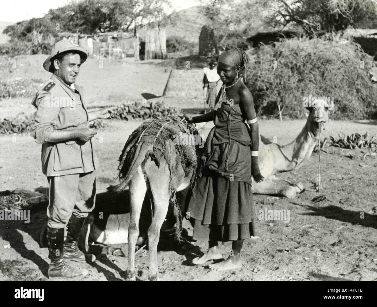 Italian colonial soldier with black woman and camels, Ethiopia Stock ...