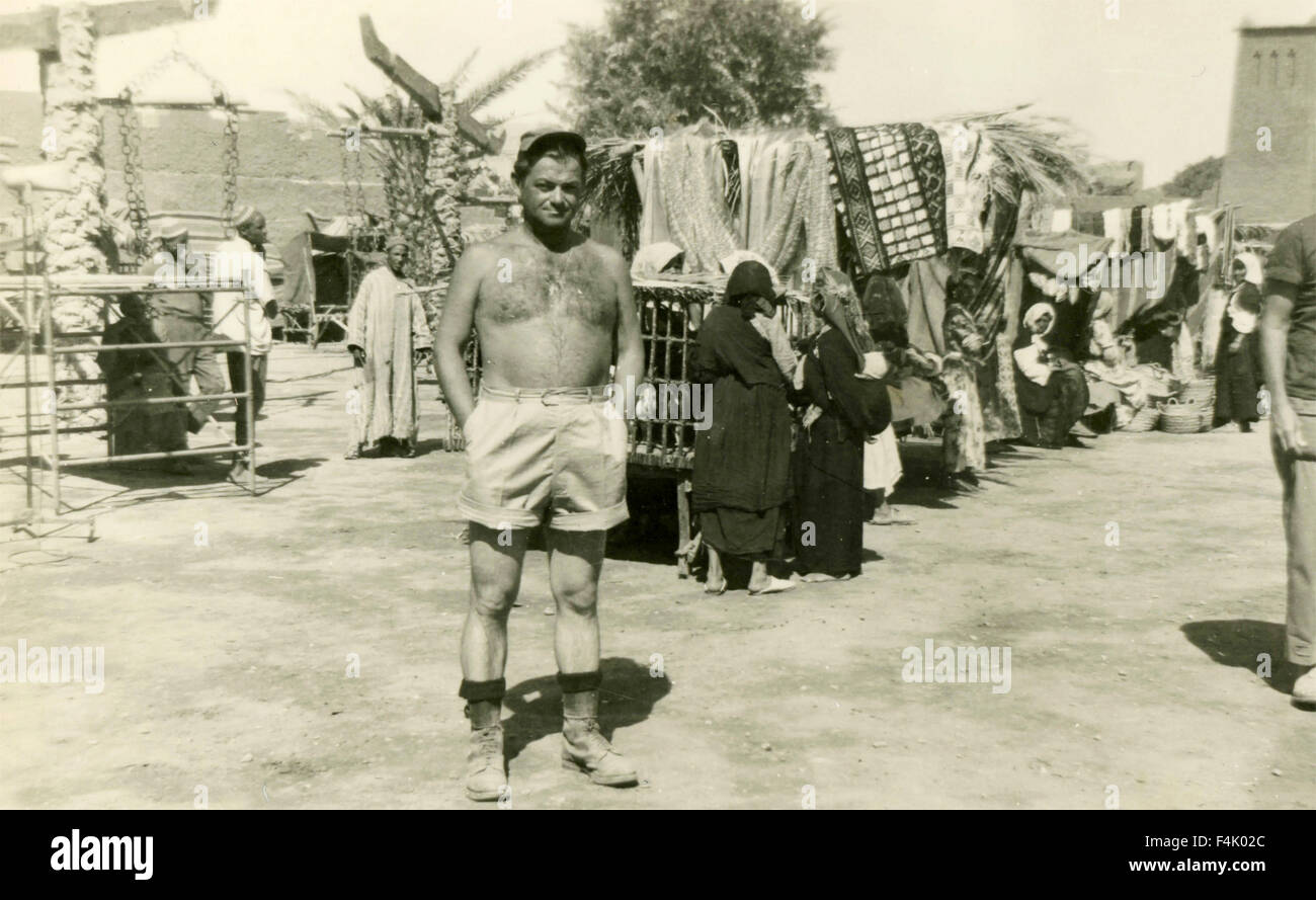 Italian colonial Soldier shirtless in a market, Ethiopia Stock Photo ...
