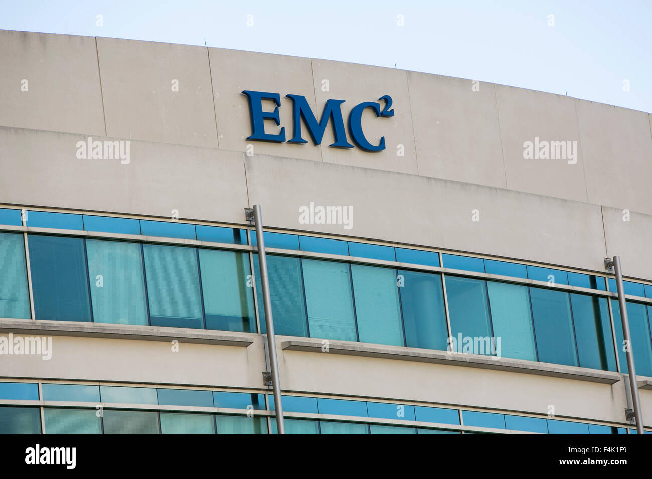 A logo sign outside of an office building occupied by EMC Corporation ...