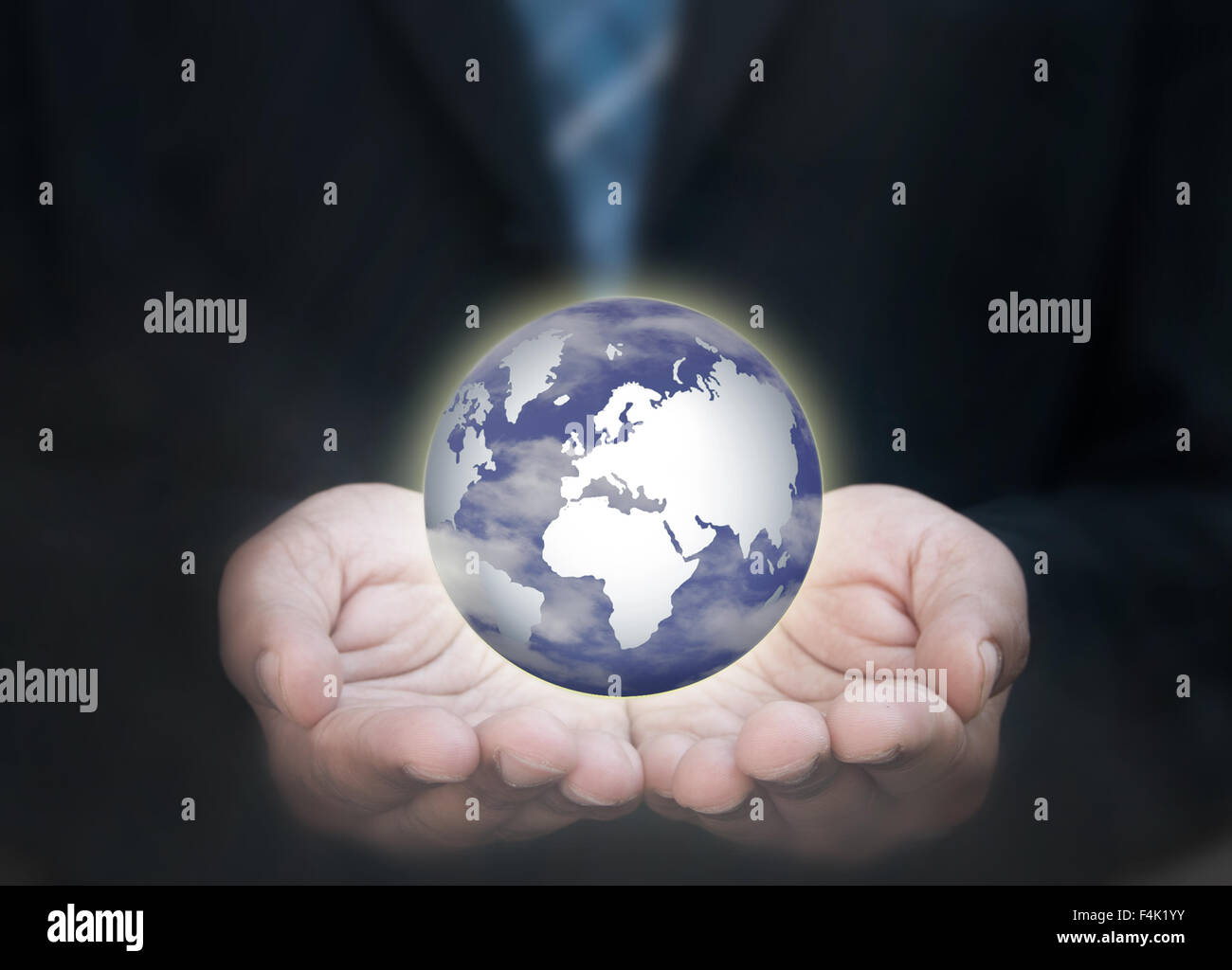 Business man holding atlas globe in his hands Stock Photo - Alamy