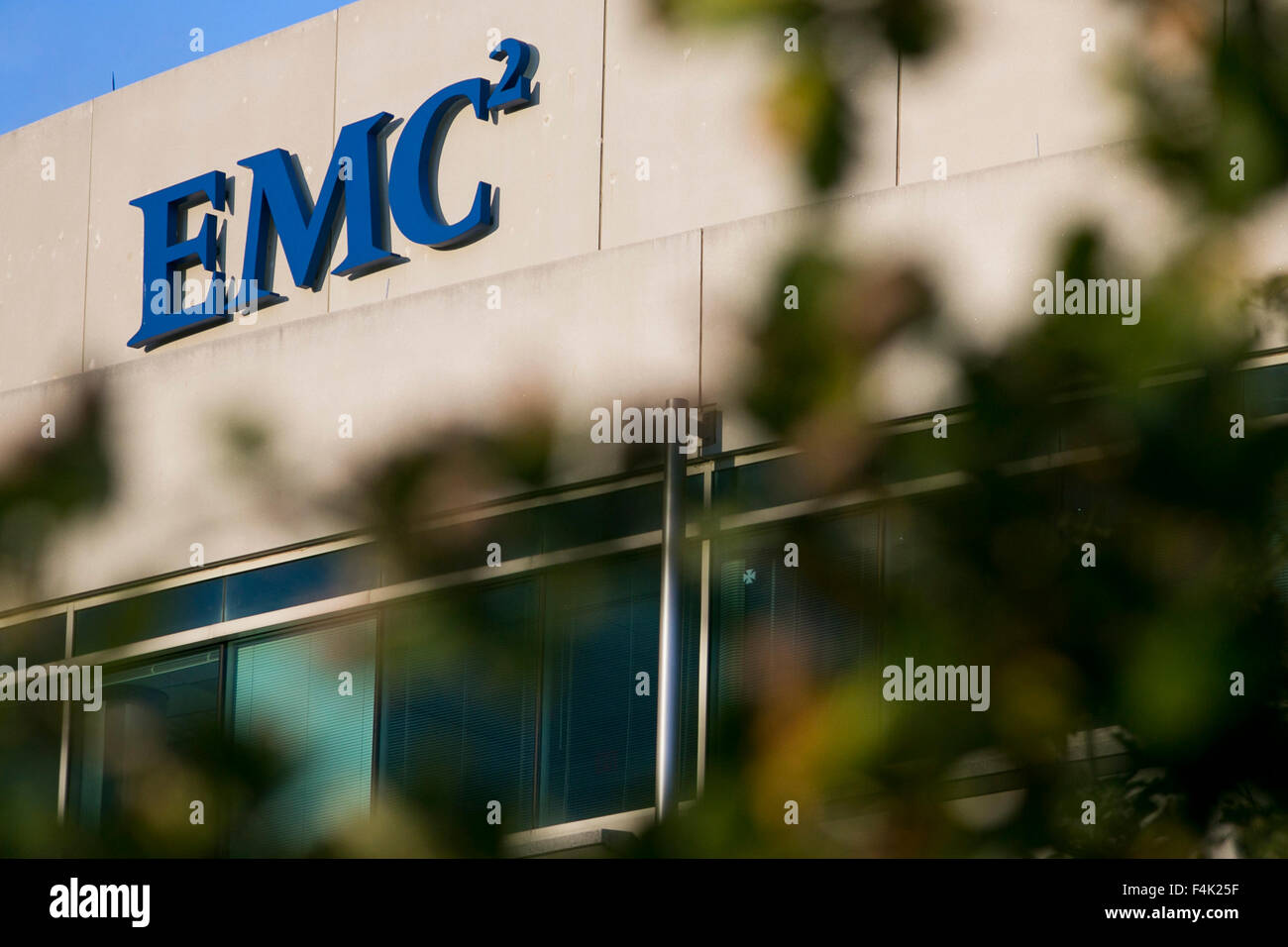 A logo sign outside of an office building occupied by EMC Corporation ...