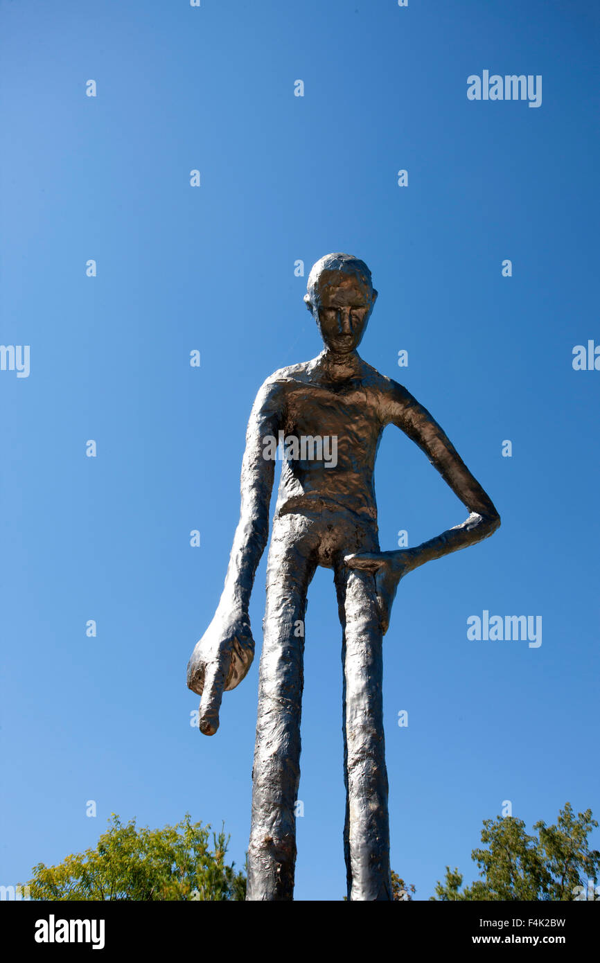 Metal Statue in Elora Ontario man standing blue sky Stock Photo - Alamy