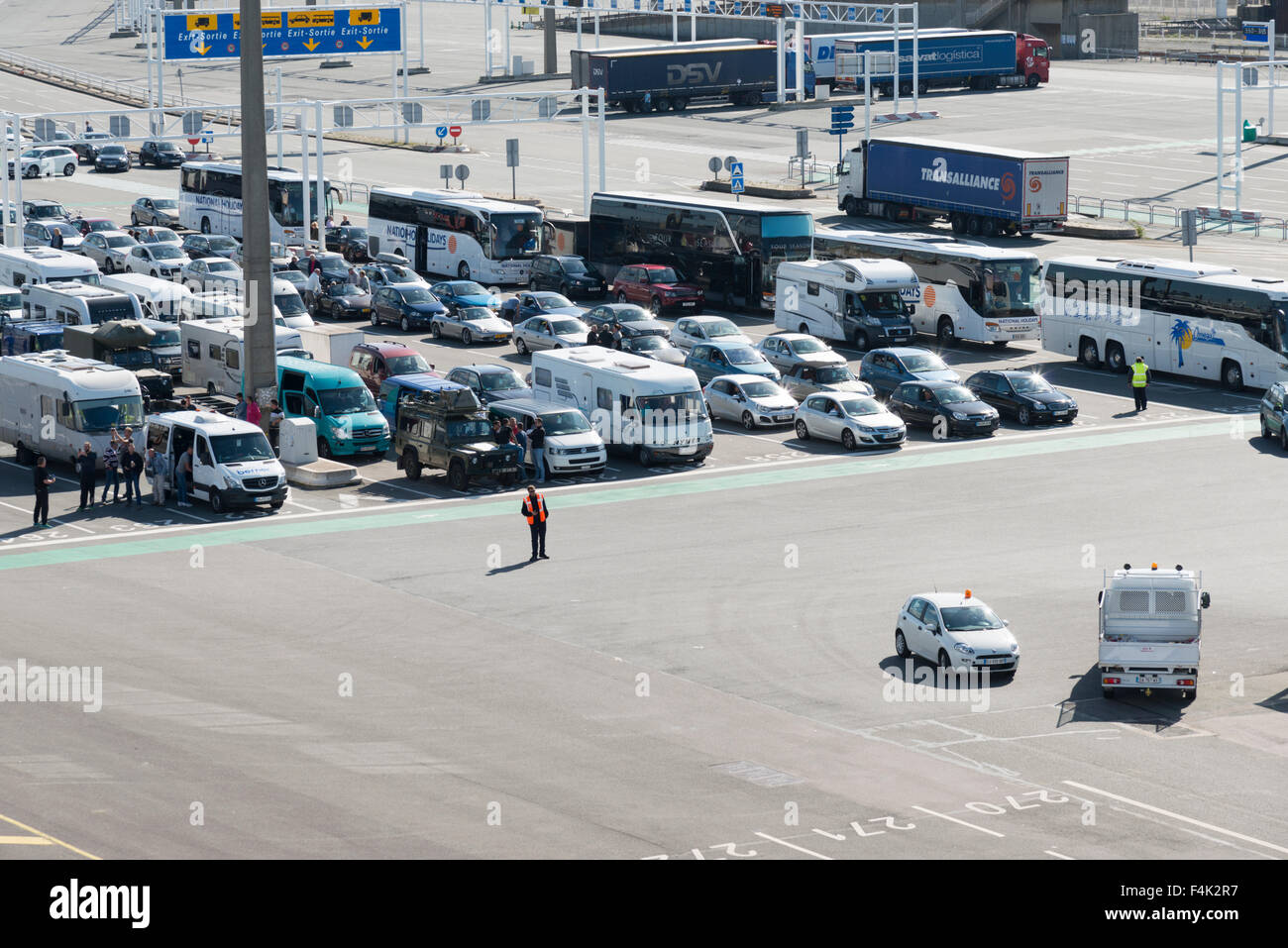 Queues of cars and traffic waiting to board a ferry at the port of ...