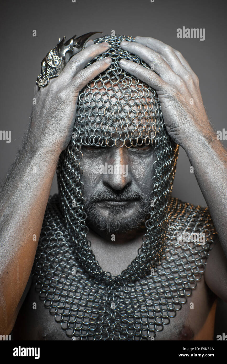 man in chain mail and leather painted silver, medieval warrior Stock ...