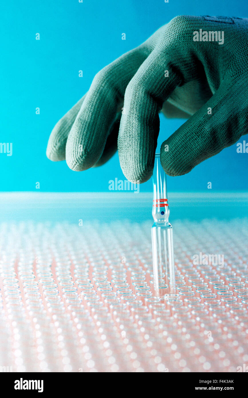 Gloved Hand Holding Test Tube Stock Photo - Alamy