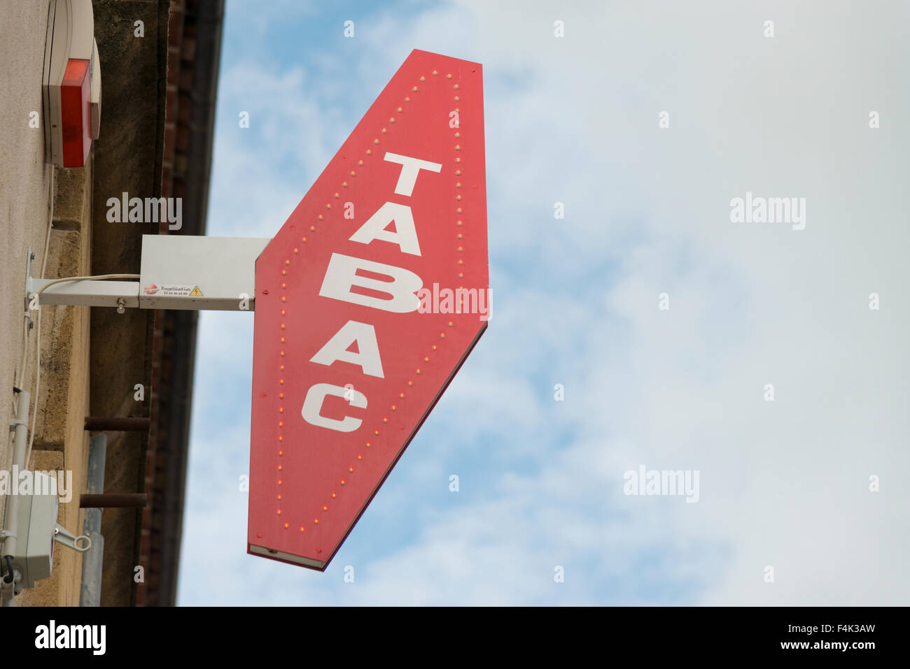 A french tobacconist or Tabac sign on a wll outside a shop in France ...