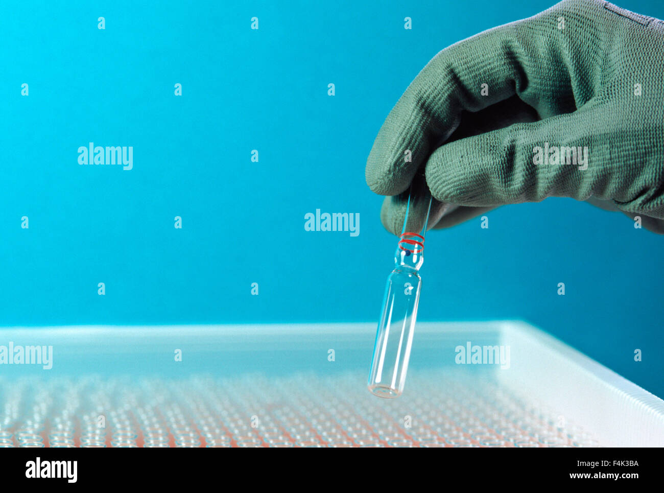 Gloved Hand Holding Test Tube Stock Photo - Alamy