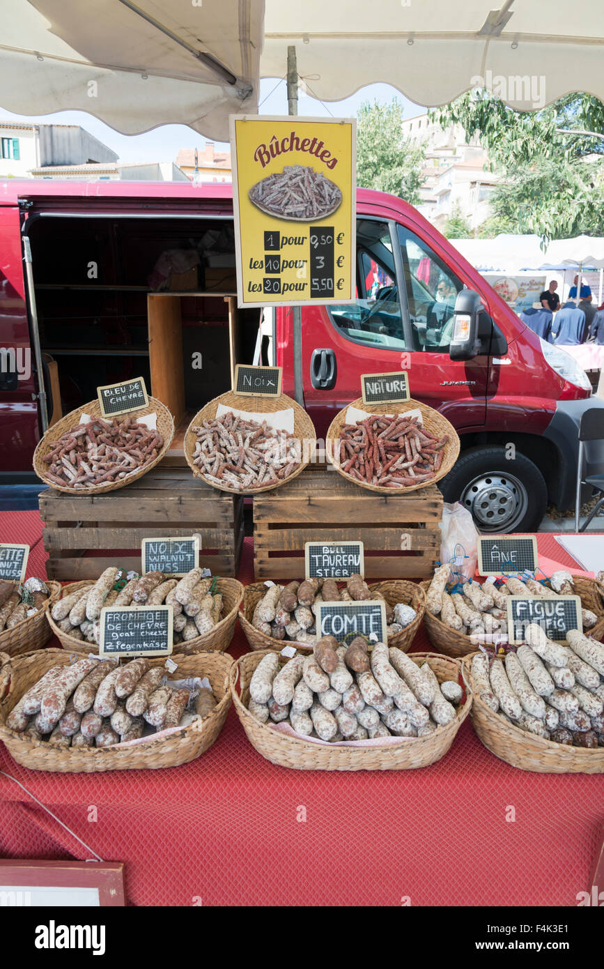 A market stall selling charcuterie and sausages in a french market in ...