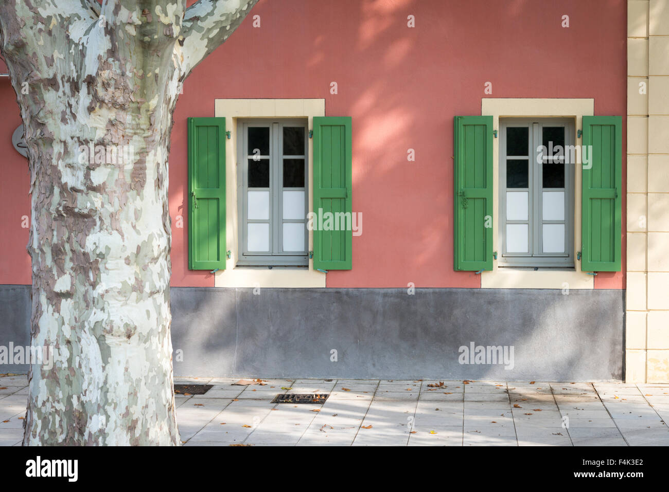 Pretty french windows in pastel colours on a building in Provence ...