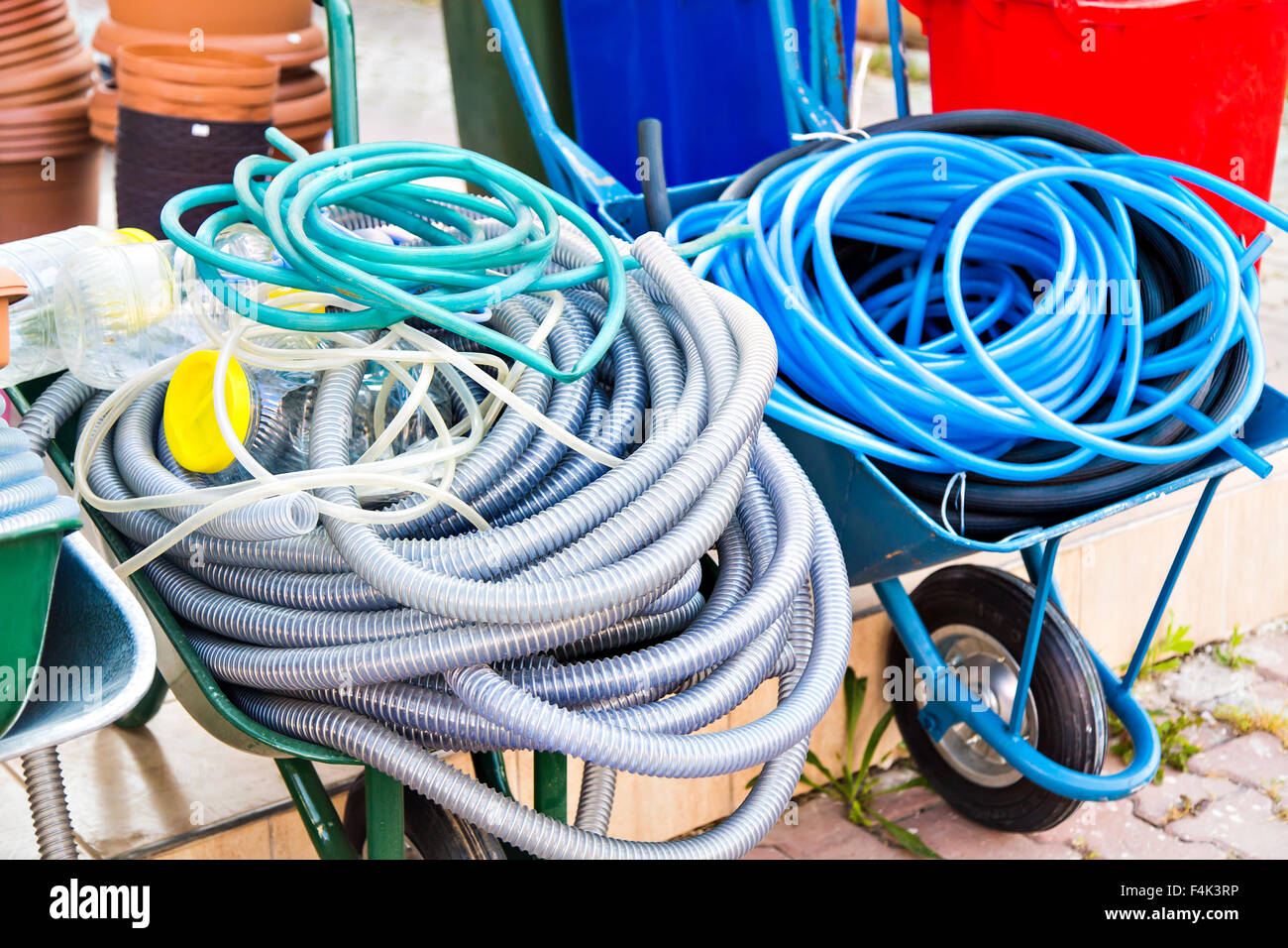 Hoses are rolled up in storage Stock Photo - Alamy