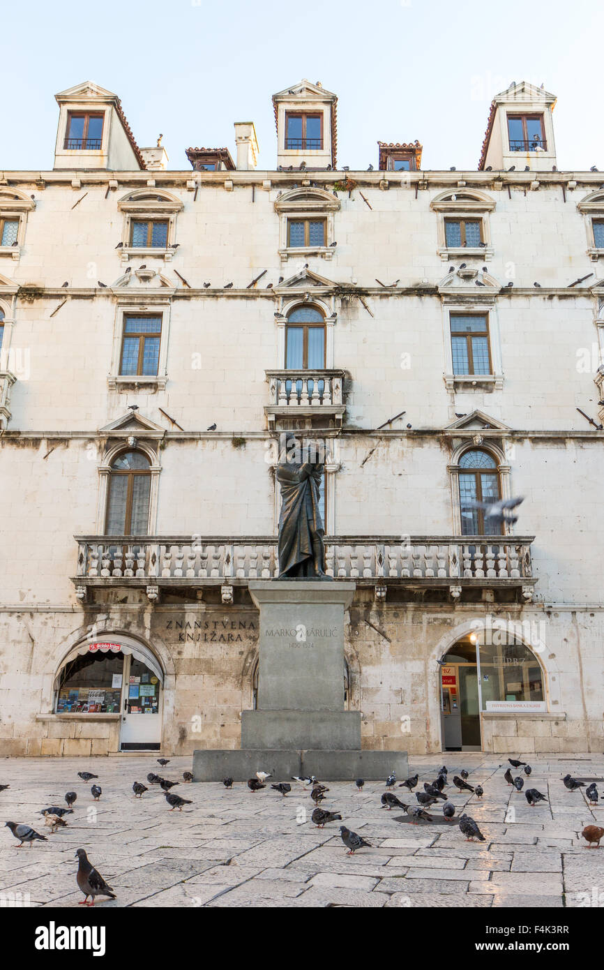 Pigeons in front of a statue of Marko Marulic at the Diocletian's ...