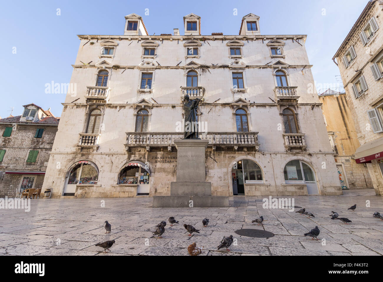 Pigeons in front of a statue of Marko Marulic at the Diocletian's ...