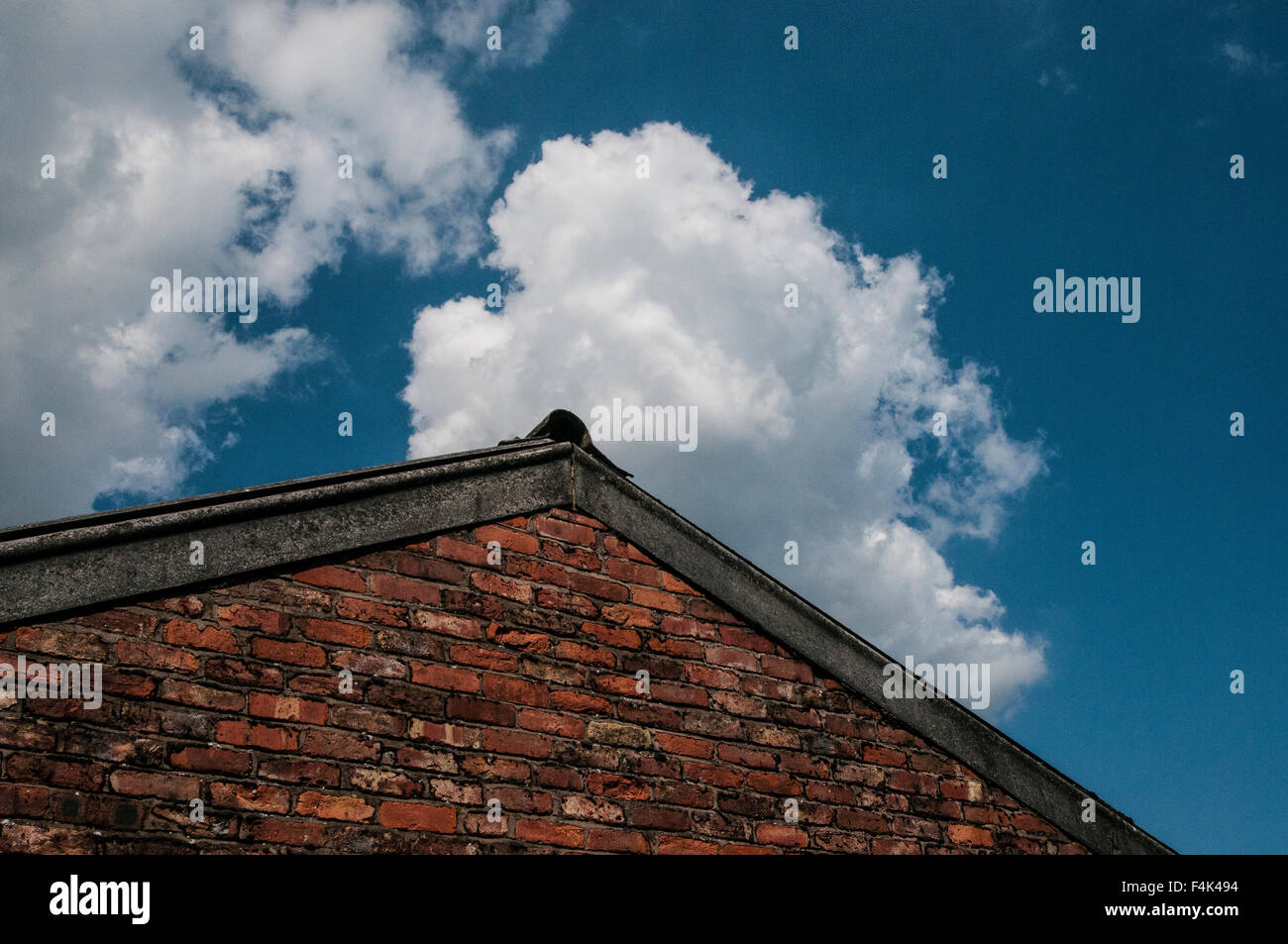 Clouds over gable end Stock Photo - Alamy