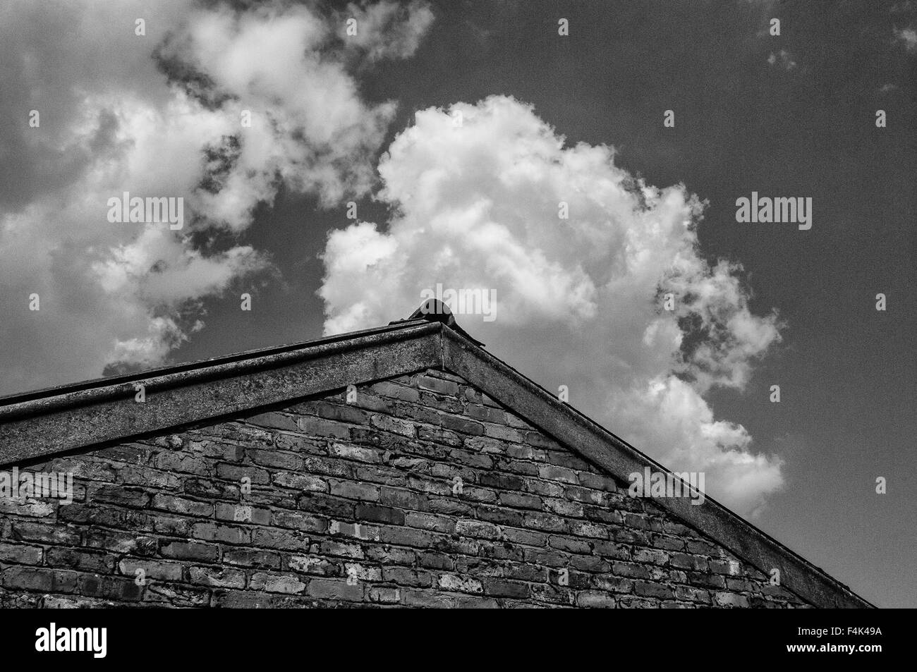 Clouds over gable end Stock Photo - Alamy