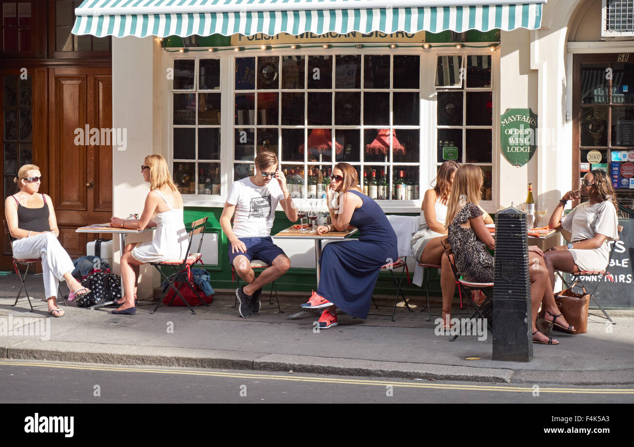 People sitting outside cafe in Mayfair, London England United Kingdom ...