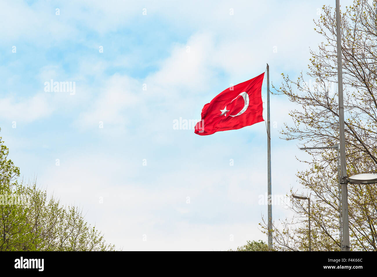 Waving flag of Turkey under blue sky Stock Photo - Alamy