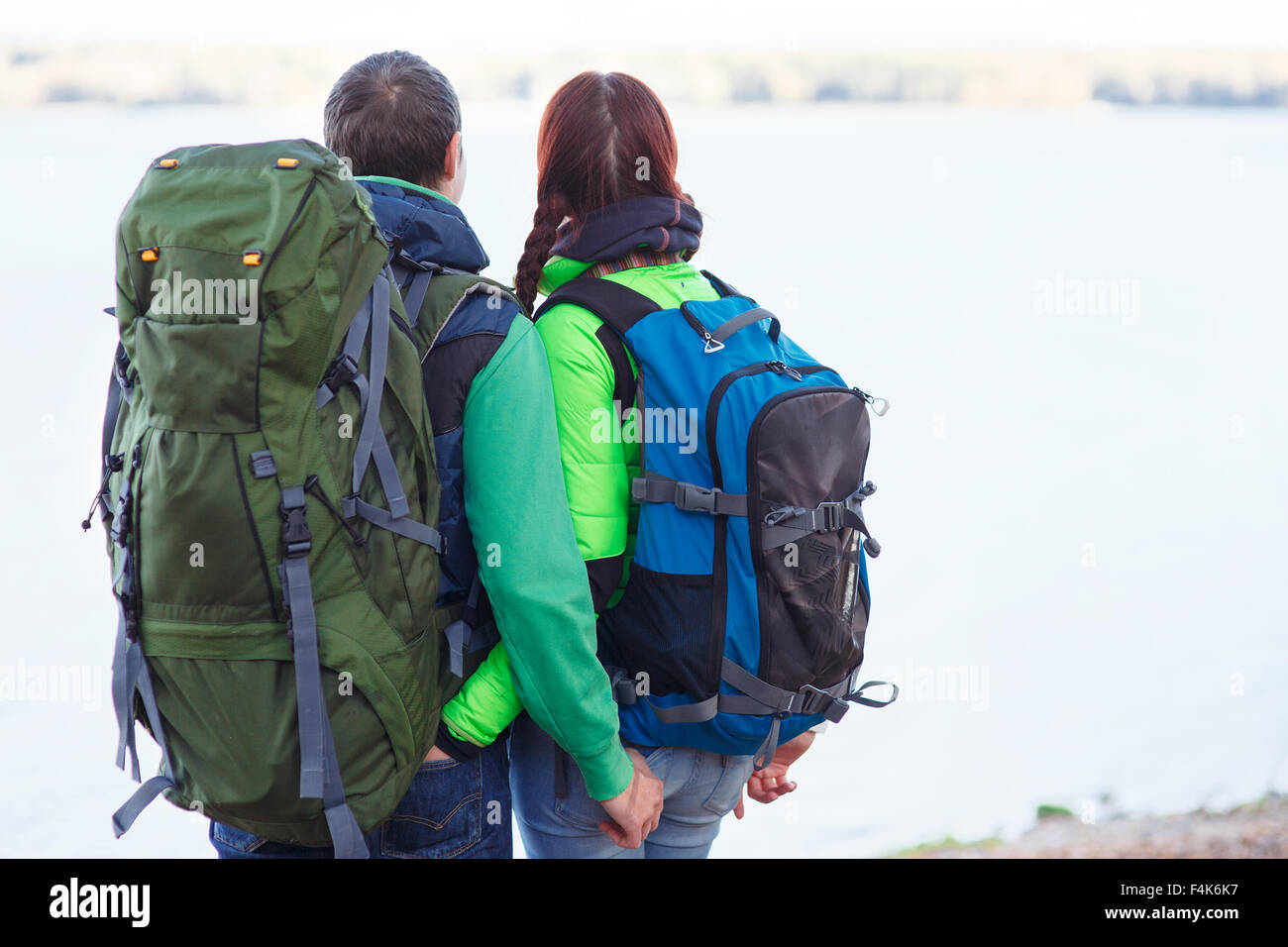 woman and man standing relaxed on lake Stock Photo - Alamy