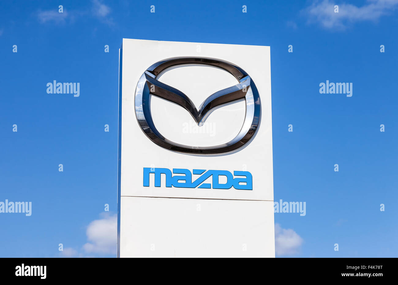 Official dealership sign of Mazda. Mazda Motor Corporation is a ...