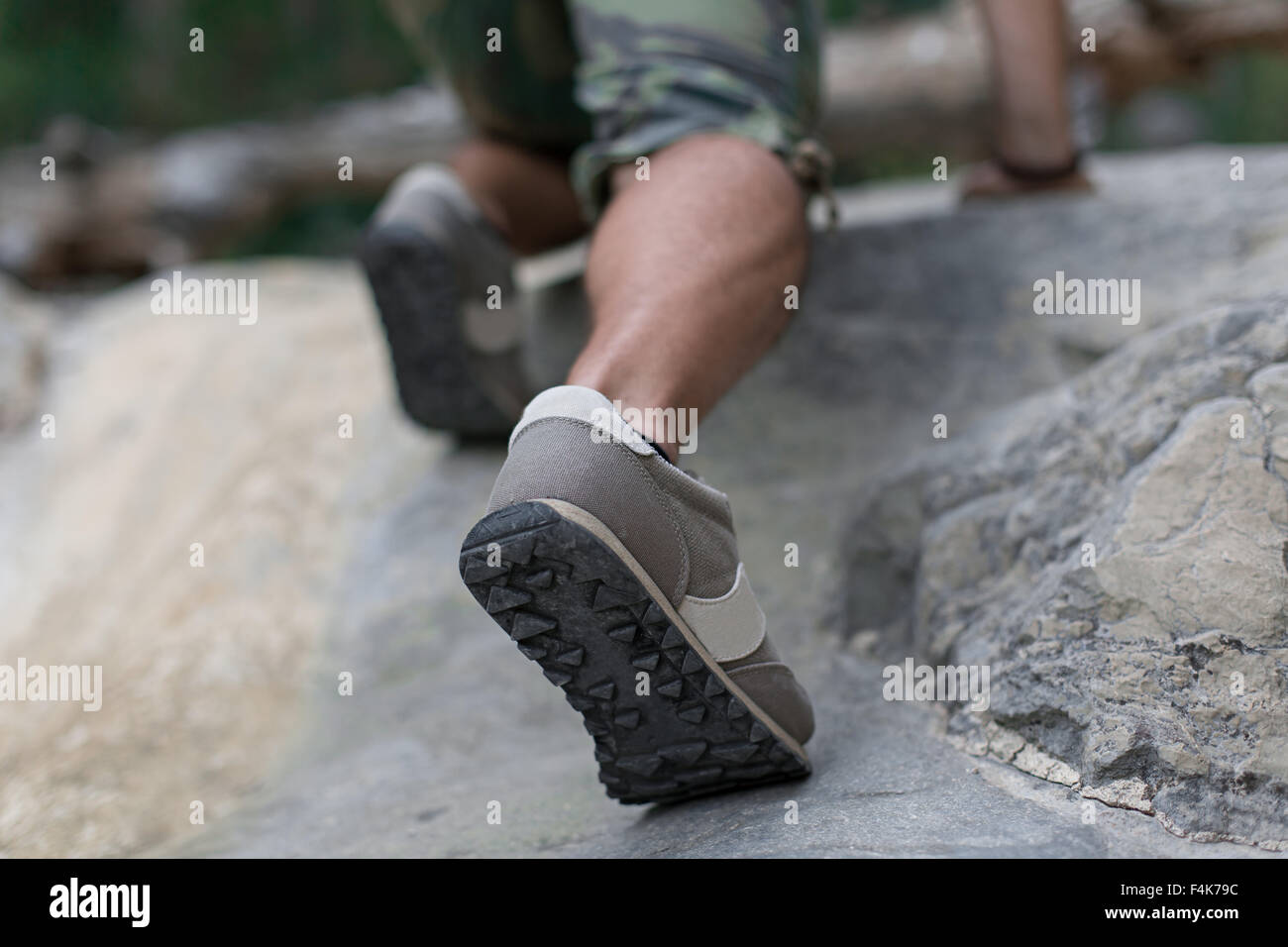 male legs closeup climb the mountain in the wood Stock Photo - Alamy