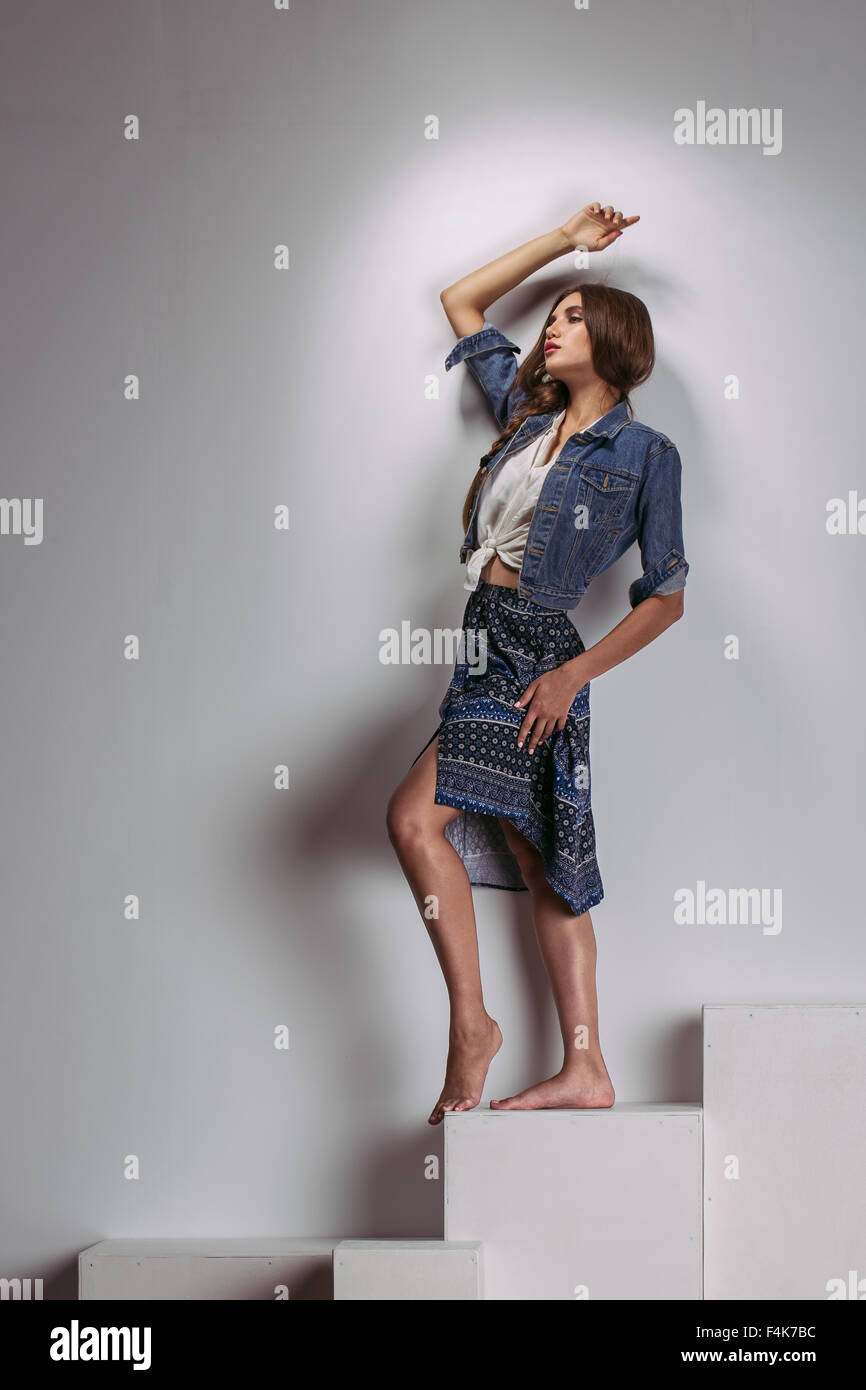 fashion female model posing on light background Stock Photo - Alamy