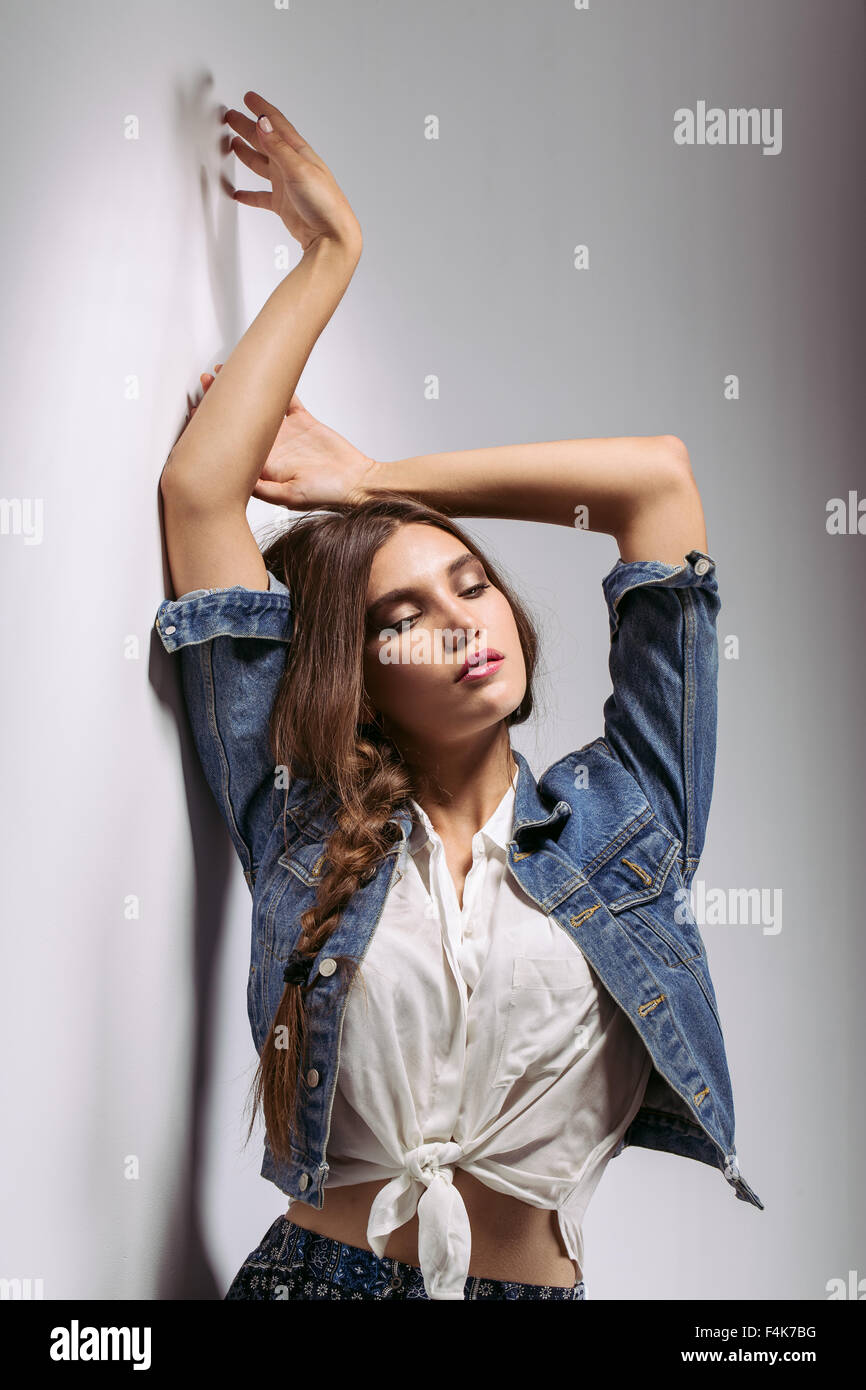 fashion female model posing on light background Stock Photo - Alamy