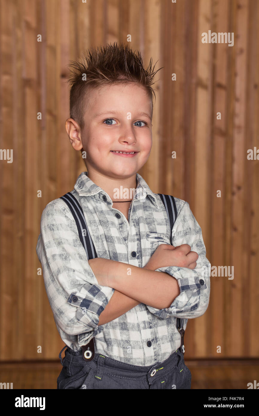 Boy model in the studio on wooden background Stock Photo - Alamy
