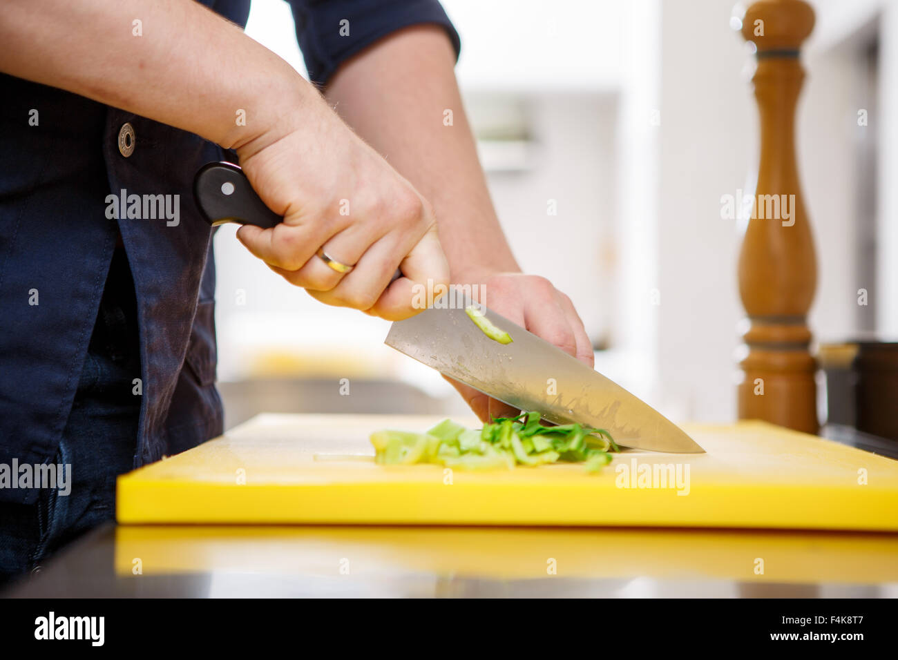 Chef chopping greens Stock Photo - Alamy
