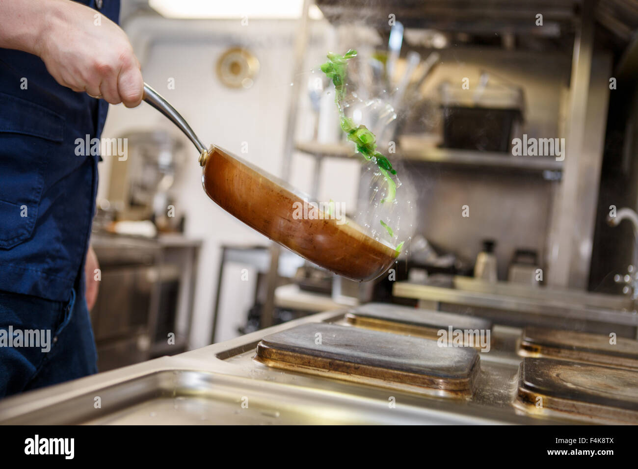 Chef in restaurant kitchen Stock Photo - Alamy