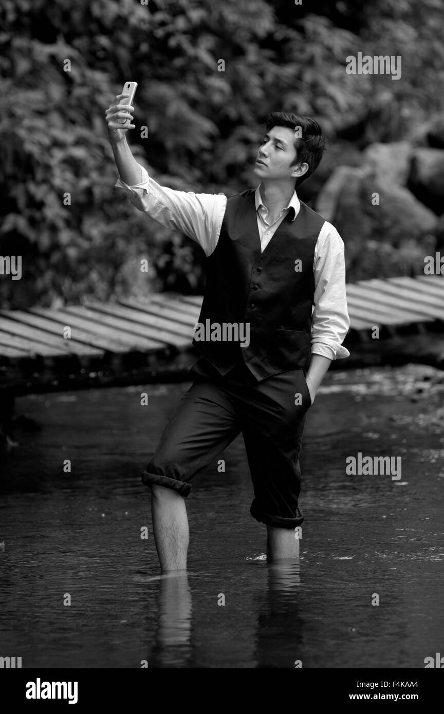 Tourist taking selfie photo Black and White Stock Photos & Images - Alamy