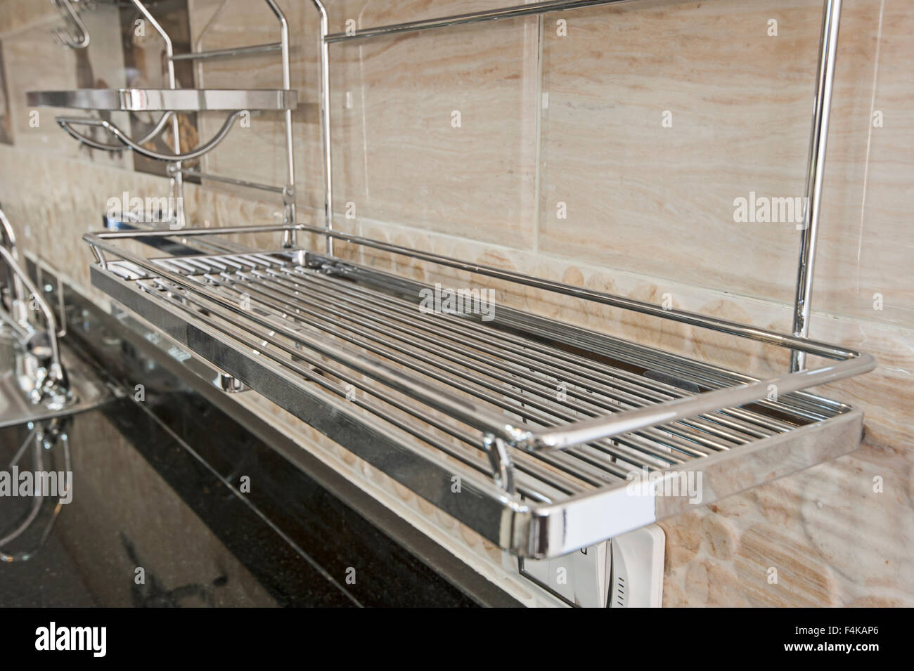 Silver metal drying shelf rack in a luxury kitchen interior Stock Photo ...
