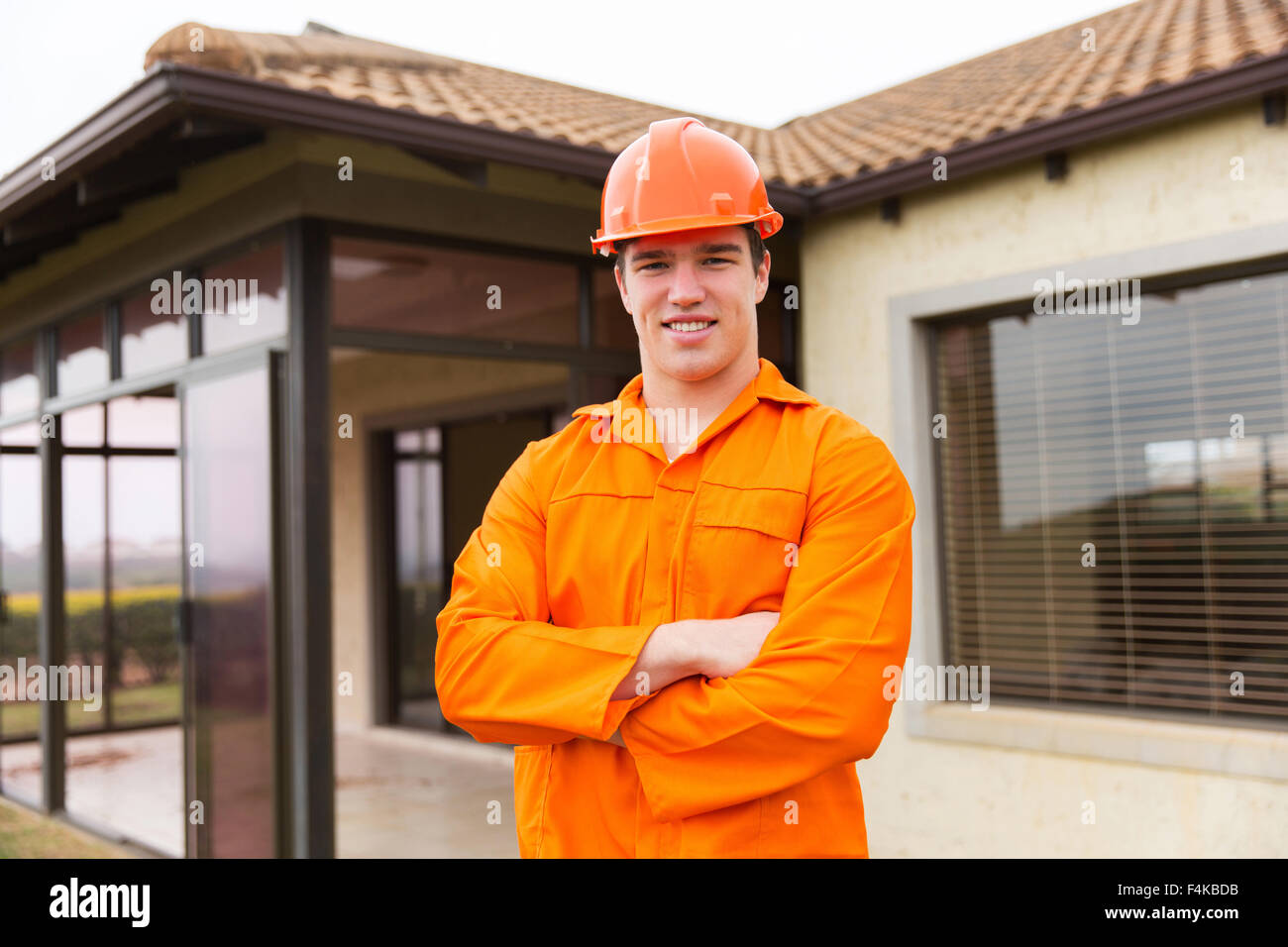 Man in work uniform arms crossed hi-res stock photography and images ...