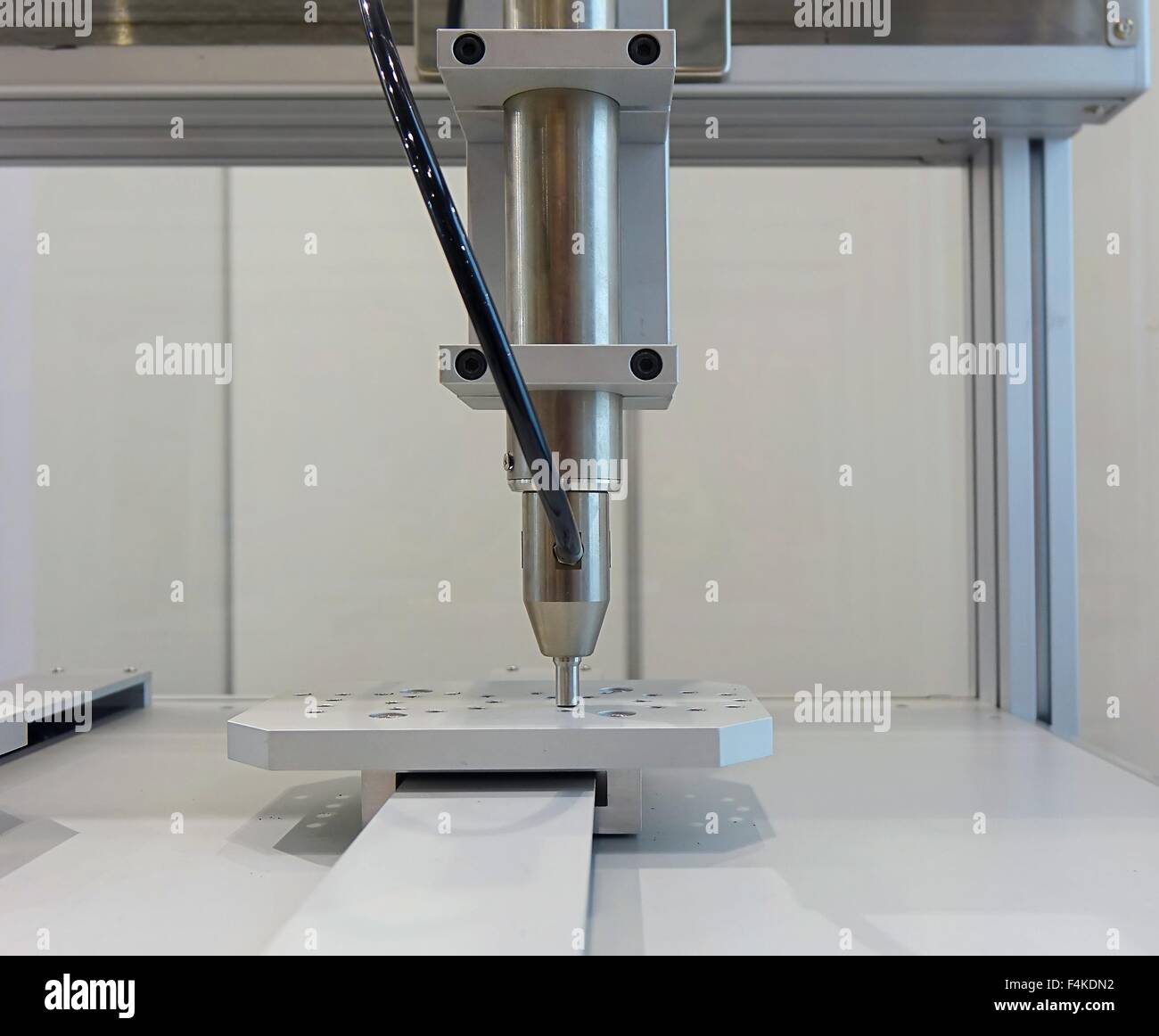 A high precision automated drilling tool in operation on a piece of ...
