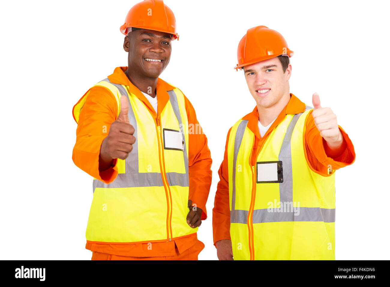 happy young engineers giving thumbs up Stock Photo - Alamy