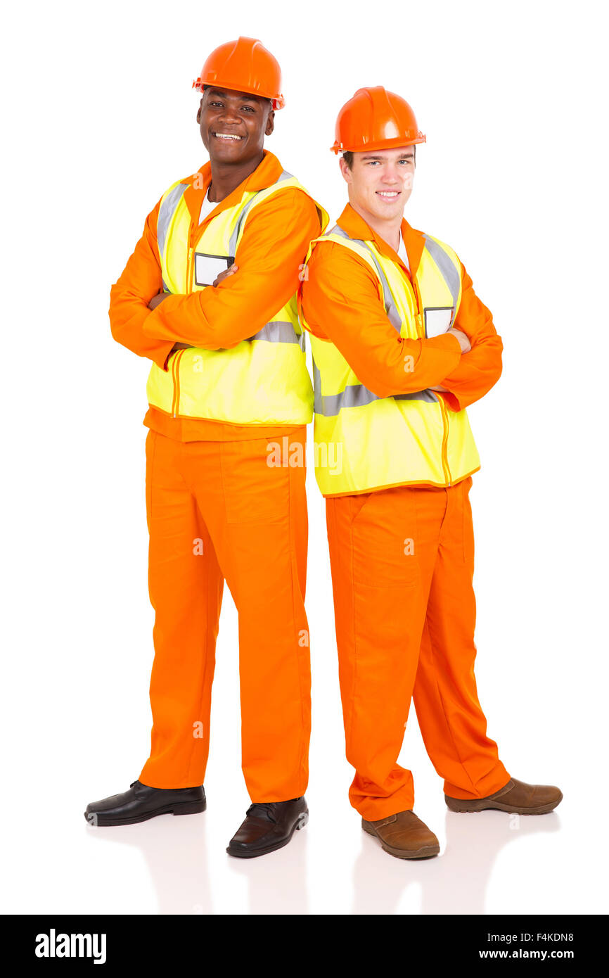 portrait of industrial workers standing back to back on white ...