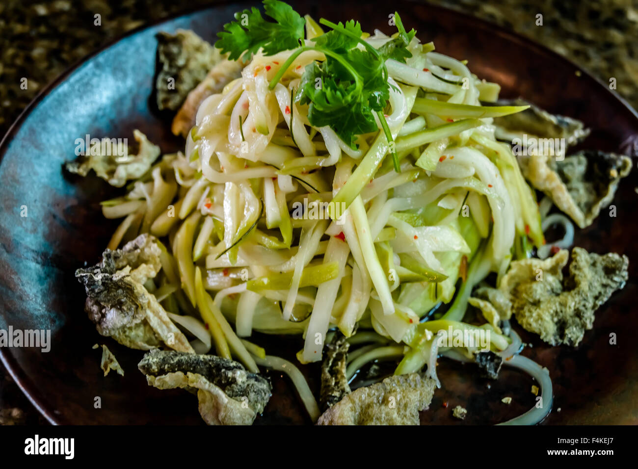 Green Mango Salad with Crispy Fish Skins Stock Photo - Alamy