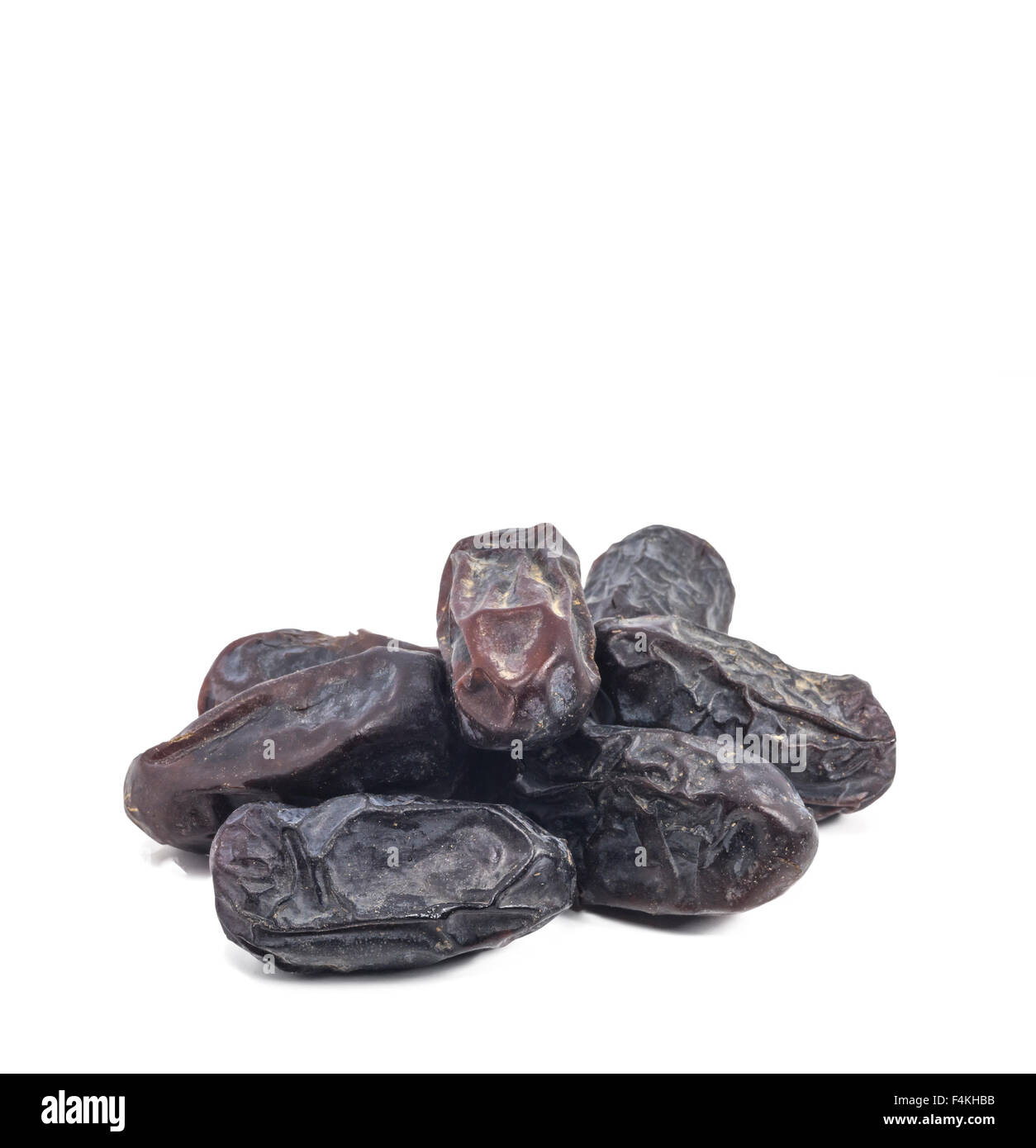 A stack of dry dates with isolated white background Stock Photo - Alamy