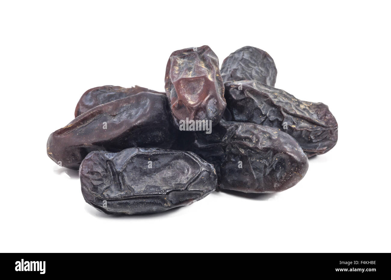 A stack of dry dates with isolated white background Stock Photo - Alamy
