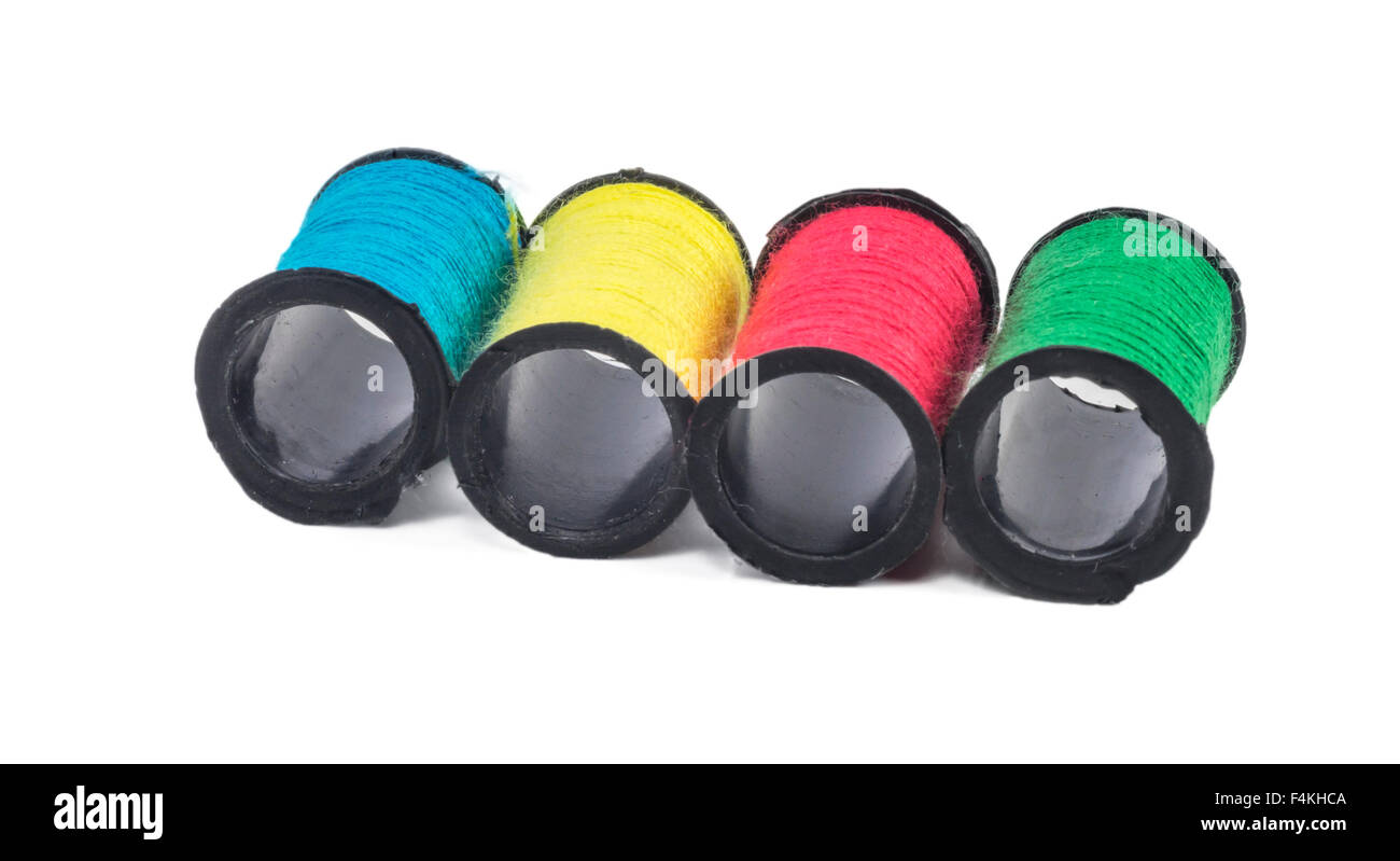 Multi color sewing thread with isolated white background Stock Photo ...