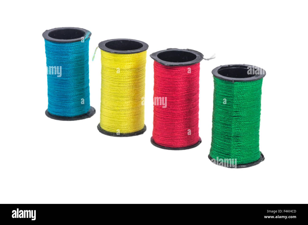 Multi color sewing thread with isolated white background Stock Photo ...